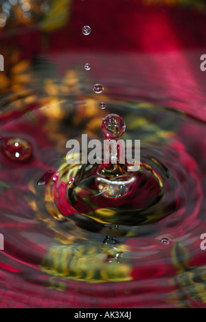 Close-up of wave splashing in sea against blue sky Stock Photo - Alamy