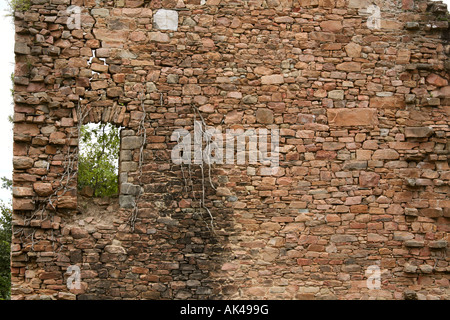 Crumbling stone wall with arched window Stock Photo - Alamy