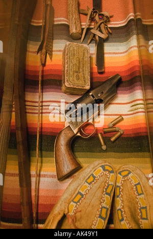 Old west Colt revolver and US banknotes and silver certificates with ...