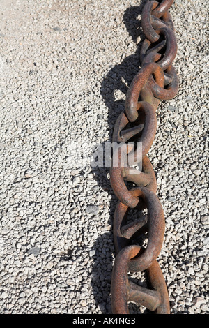big rusty chain laying on floor Stock Photo - Alamy