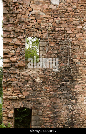 Crumbling stone wall with arched window Stock Photo - Alamy