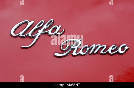 Alfa Romeo script name badge on red Alfa Spider Stock Photo - Alamy