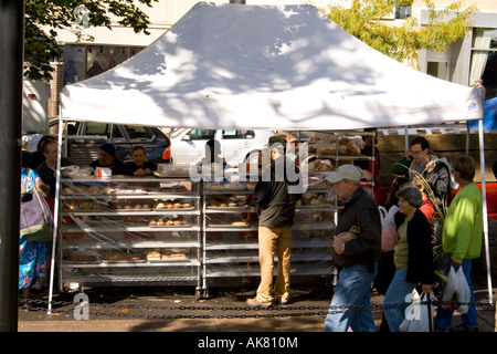 Farmers Market, Madison, WI USA. Aug 2018. Woman customer paying for ...