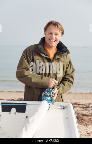 Colour portrait of 43 year old man walking along a beautiful beach ...