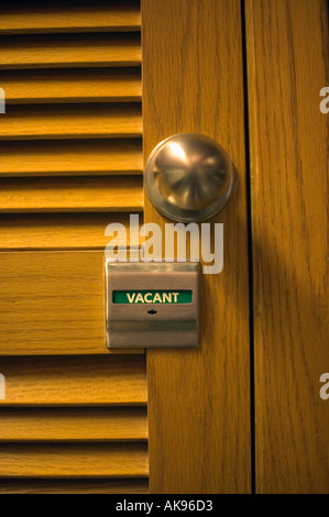 vacant door bathroom toilet sign metal white background Stock Photo - Alamy
