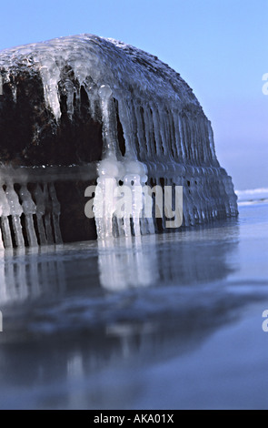 Winter by the sea. Ice-covered boulder. Ice on the sea Stock Photo - Alamy