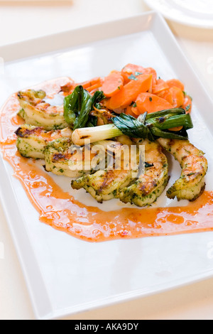 A dish of prawns with vegetables on plate Stock Photo - Alamy