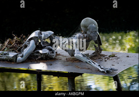 Sculpture of crawling decomposing man in metal, at Burghley House ...