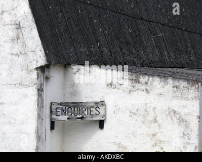 old dirty enquiries sign on white wall Stock Photo - Alamy