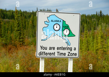 Time zone change sign marker at border of Yukon Territory Canada and ...