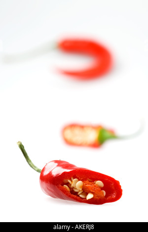 Hot red chilli sliced to show seeds Stock Photo - Alamy