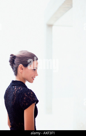 Profile view of young beautiful Spanish woman thinking Stock Photo - Alamy