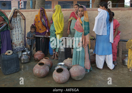 A group of Rajasthani village women collecting water 1 km from their ...