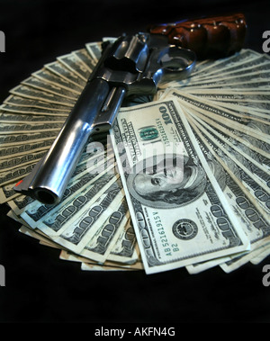 Handgun on dollar bills, top view. Killer's weapon Stock Photo - Alamy