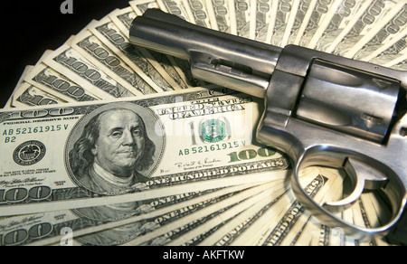 Handgun on dollar bills, top view. Killer's weapon Stock Photo - Alamy