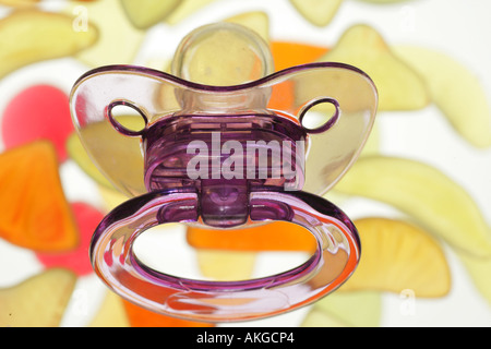 pacifier over sweets Stock Photo - Alamy