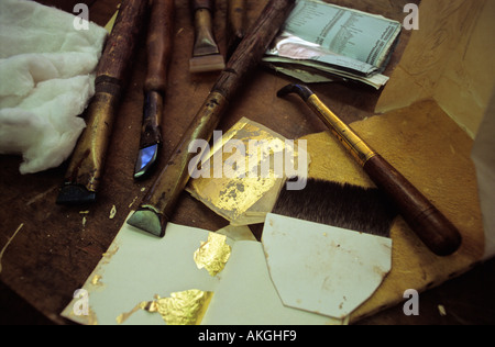 Gilding with gold leaf and gilding brush Stock Photo - Alamy