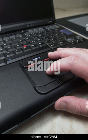 qwerty computer keyboard being used on a black laptop uk Stock Photo ...