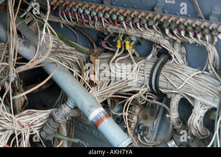 Details of the cabling in old grungy military aircraft Stock Photo - Alamy