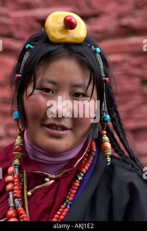 A TIBETAN WOMAN wears her hair with 108 braids while on pilgrimage in ...