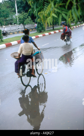 Cyclists in the streets of Mandalay after the rain Mandalay Myanmar Burma Stock Photo - Alamy