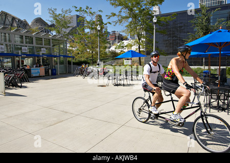 ILLINOIS Chicago Man ride bicycle past outdoor mural Pilsen Stock Photo ...