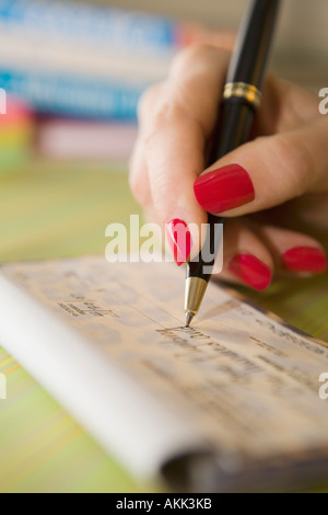 Close up of women arm writing with metallic pen. Isolated on white ...