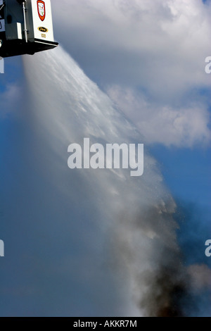 Fire Engine spraying water onto commercial building fire Illinois USA ...
