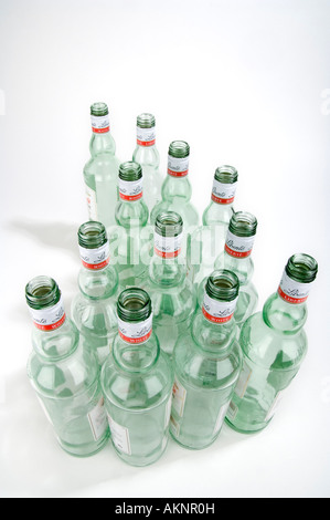 A group of empty spirit bottles on a white background Stock Photo - Alamy