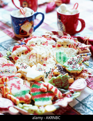 Hot chocolate in mugs on wooden background, top view Stock Photo - Alamy