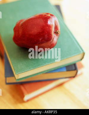 Red apple with school books on table in classroom Stock Photo - Alamy