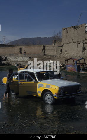 Afghan Russian made Volga taxis in snowy street Kabul Afghanistan Stock ...