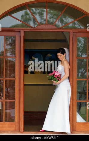 Portrait of lovely bride with purple bouquet in hands close up Stock ...