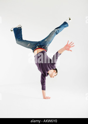 Young man doing one-handed push-ups Stock Photo - Alamy