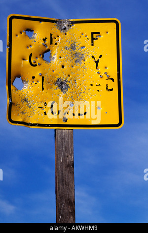 Sign, Target practice on road sign Stock Photo - Alamy