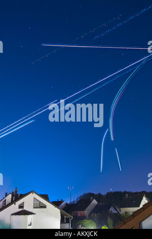 Plane in long exposure of night sky. With stars Stock Photo - Alamy