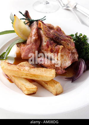A small roast chicken ( poussin ) with fries, field mushroom, grilled ...