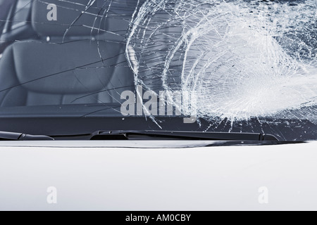 Broken car windshield after an accident with traces of blood and airbag ...