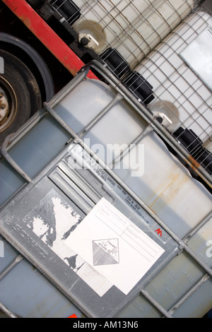 Loading an IBC onto a haulage lorry Stock Photo - Alamy