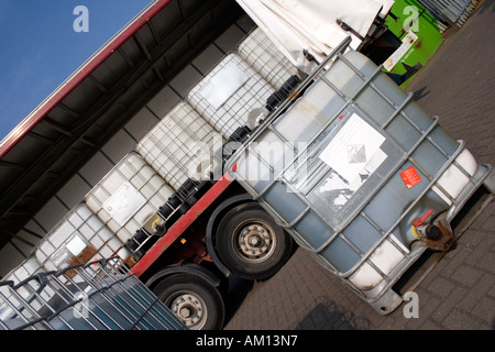 Loading an IBC onto a haulage lorry Stock Photo - Alamy