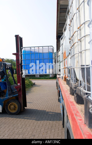 Loading an IBC onto a haulage lorry Stock Photo - Alamy
