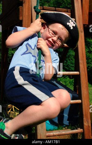 Boy playing on Tarzan rope Stock Photo - Alamy