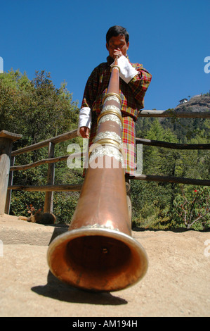 Buddhist monk blowing musical instruments Tibetan horn, Hemis Festival ...