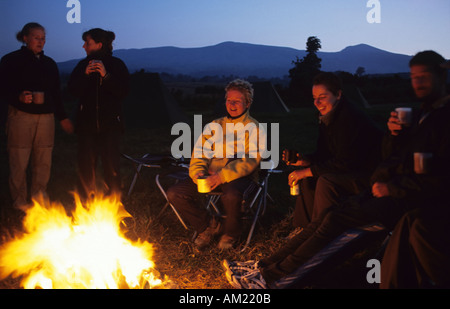 Tourists around the camp fire, Ngorongoro Crater, Tanzania Stock Photo ...