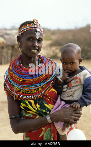 A smiling Samburu young woman with colorful necklaces, headdress and ...
