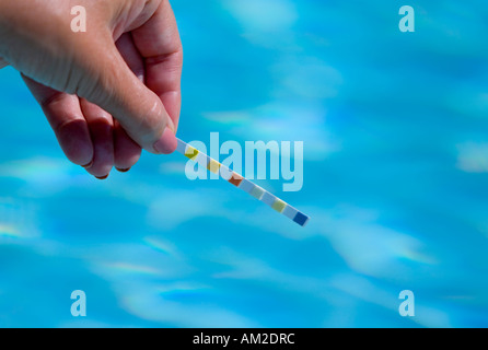 Checking chemical levels in a pool Stock Photo - Alamy