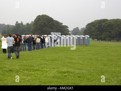 Toilet queue at outdoors pop concert Stock Photo - Alamy