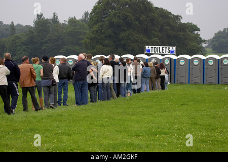Toilet queue at outdoors pop concert Stock Photo - Alamy