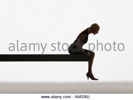 Young woman sitting on a ledge Stock Photo: 17080952 - Alamy