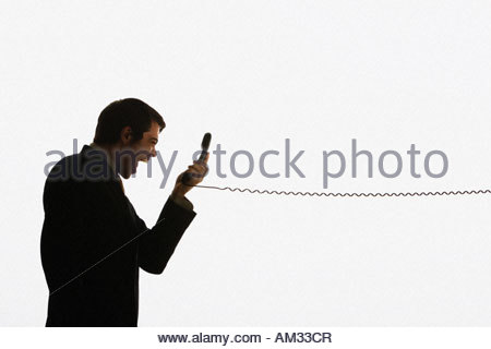 Businessman shouting down a phone Stock Photo: 4731398 - Alamy